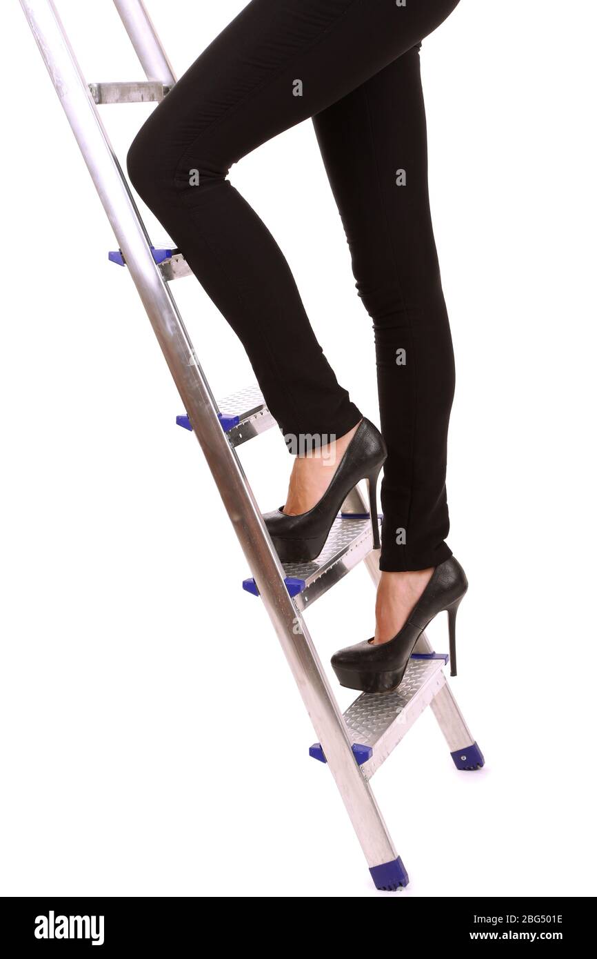 Woman climbing up ladder isolated on white Stock Photo - Alamy