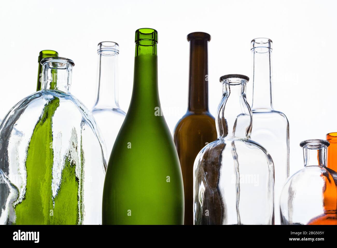 various empty bottles and view of gray sky thought home window glass on ...