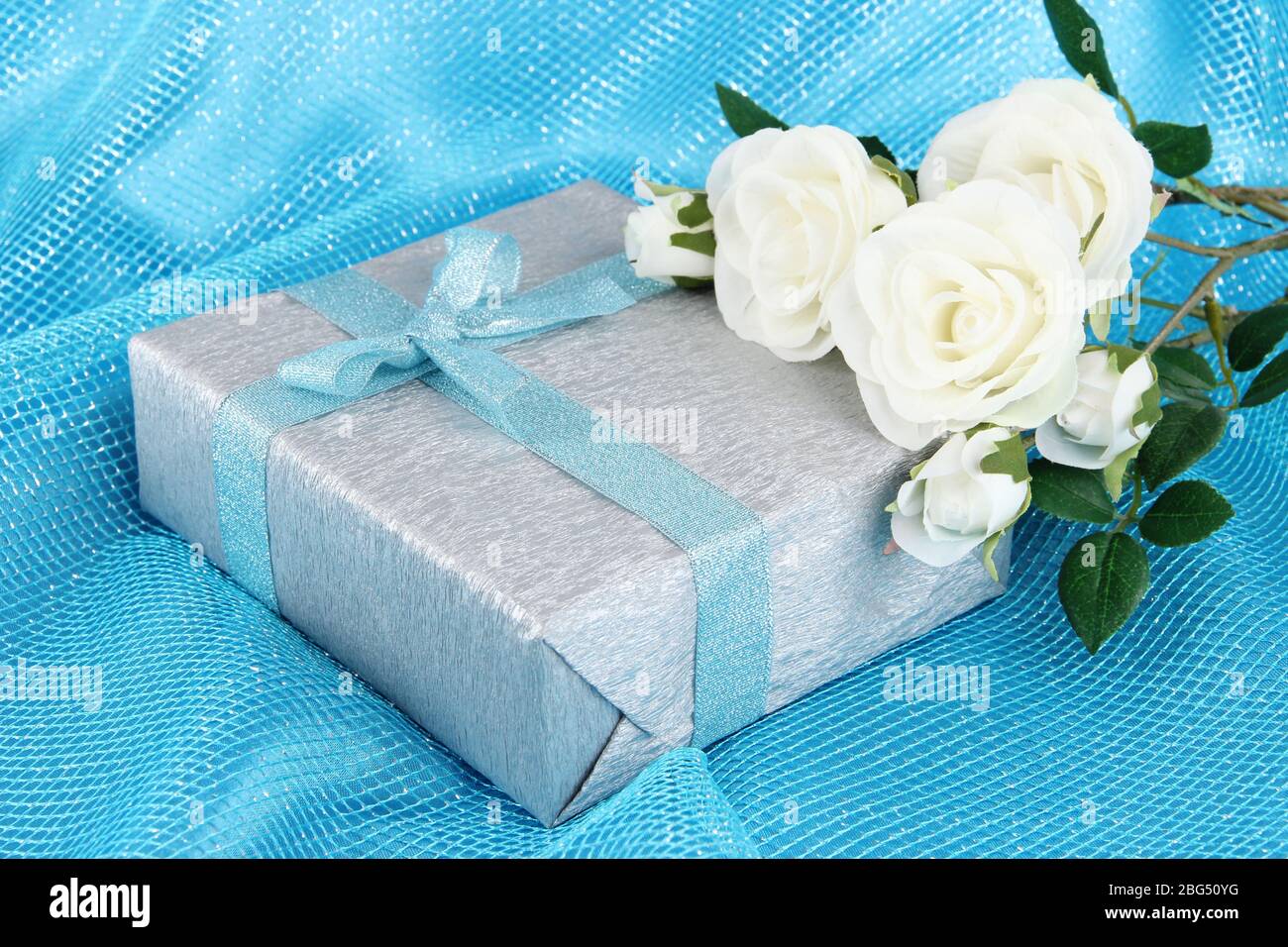 Romantic parcel on blue cloth background Stock Photo - Alamy