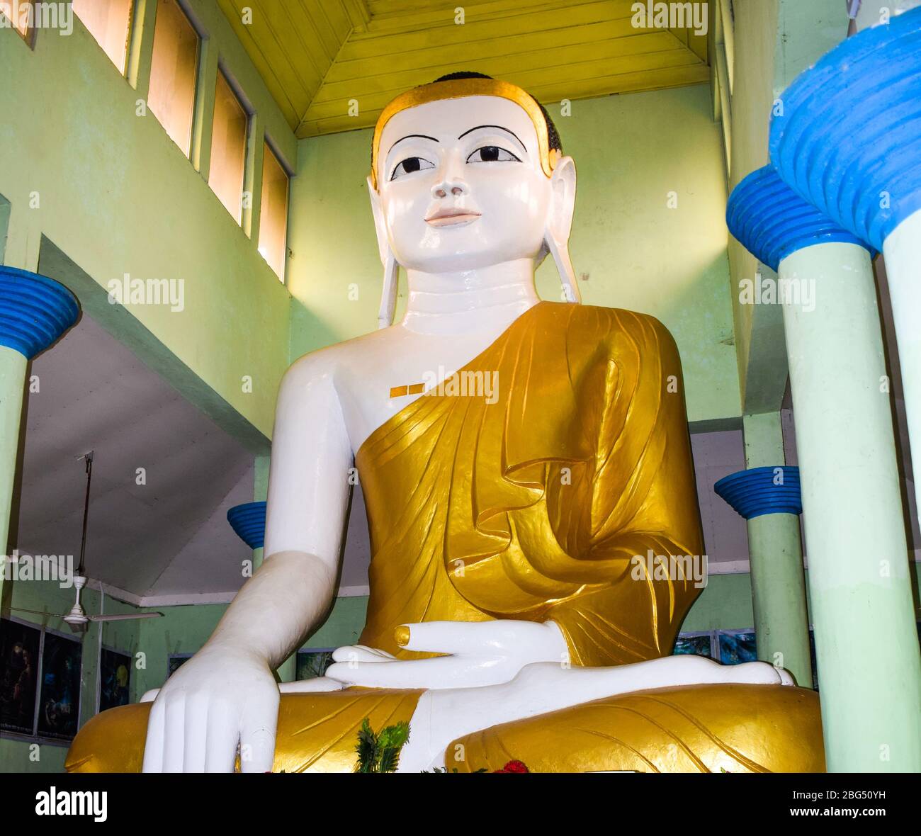 A statue made with real solid gold of gautama Buddha in a rural village ...