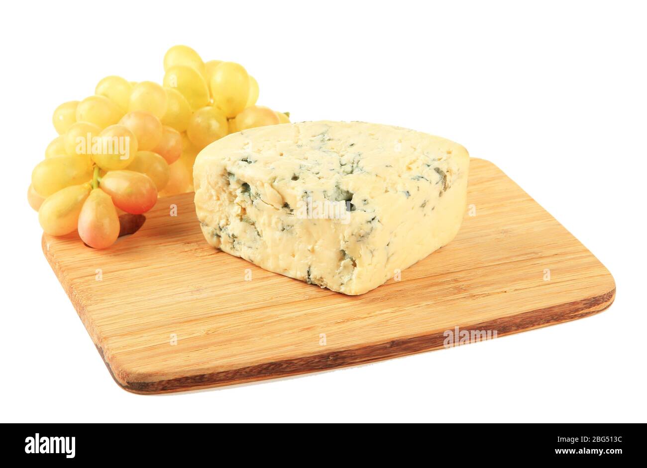 Tasty blue cheese and grape on cutting board, isolated on white Stock ...