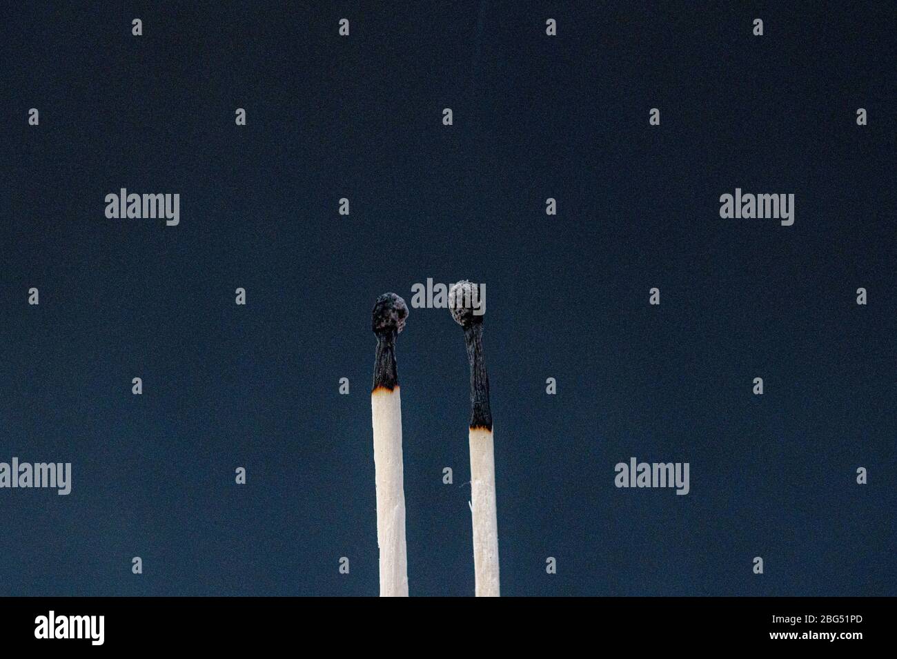Two charred match sticks Stock Photo - Alamy
