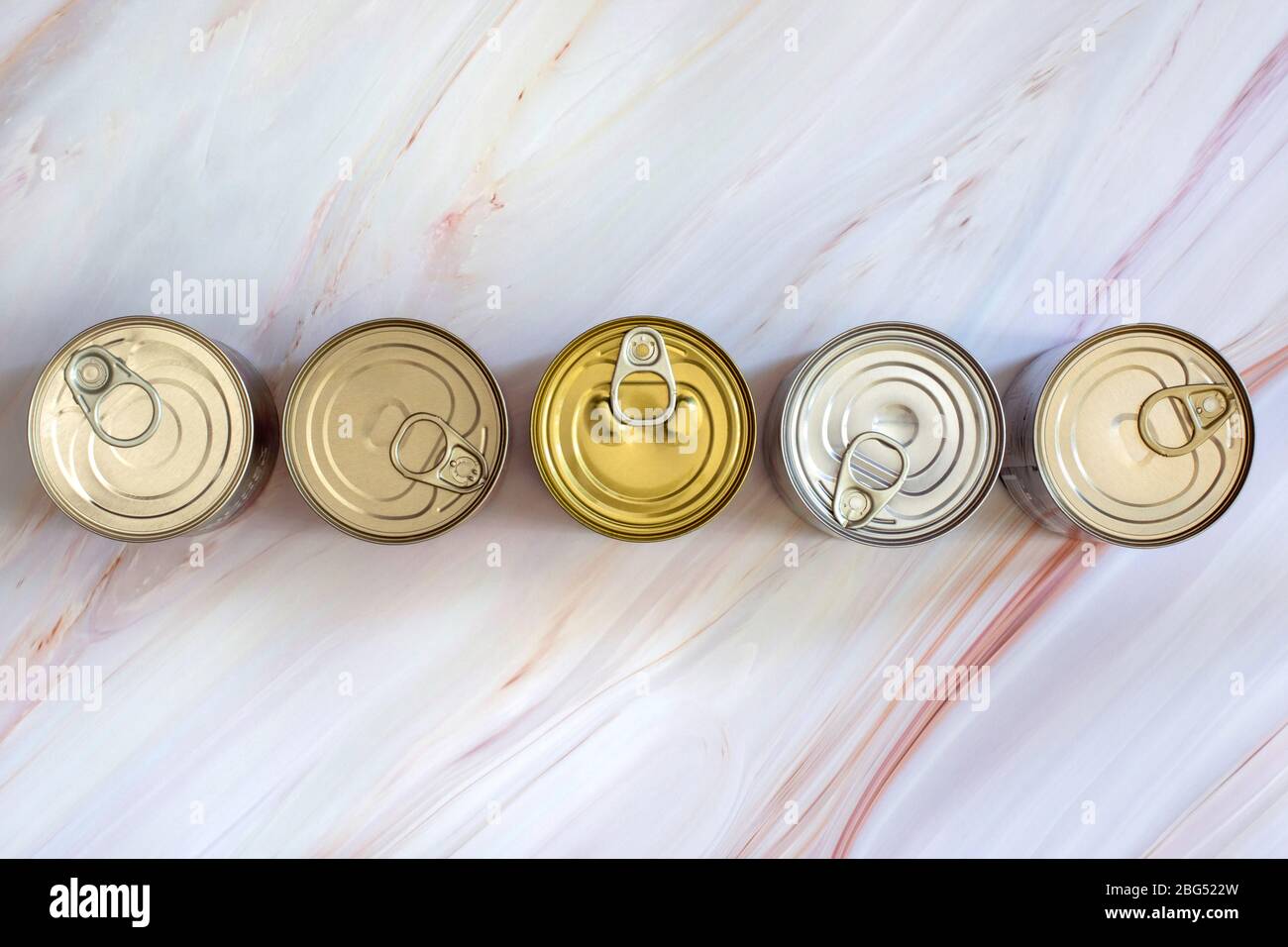 Overhead view row canned food in different sizes and colors. Stock non ...