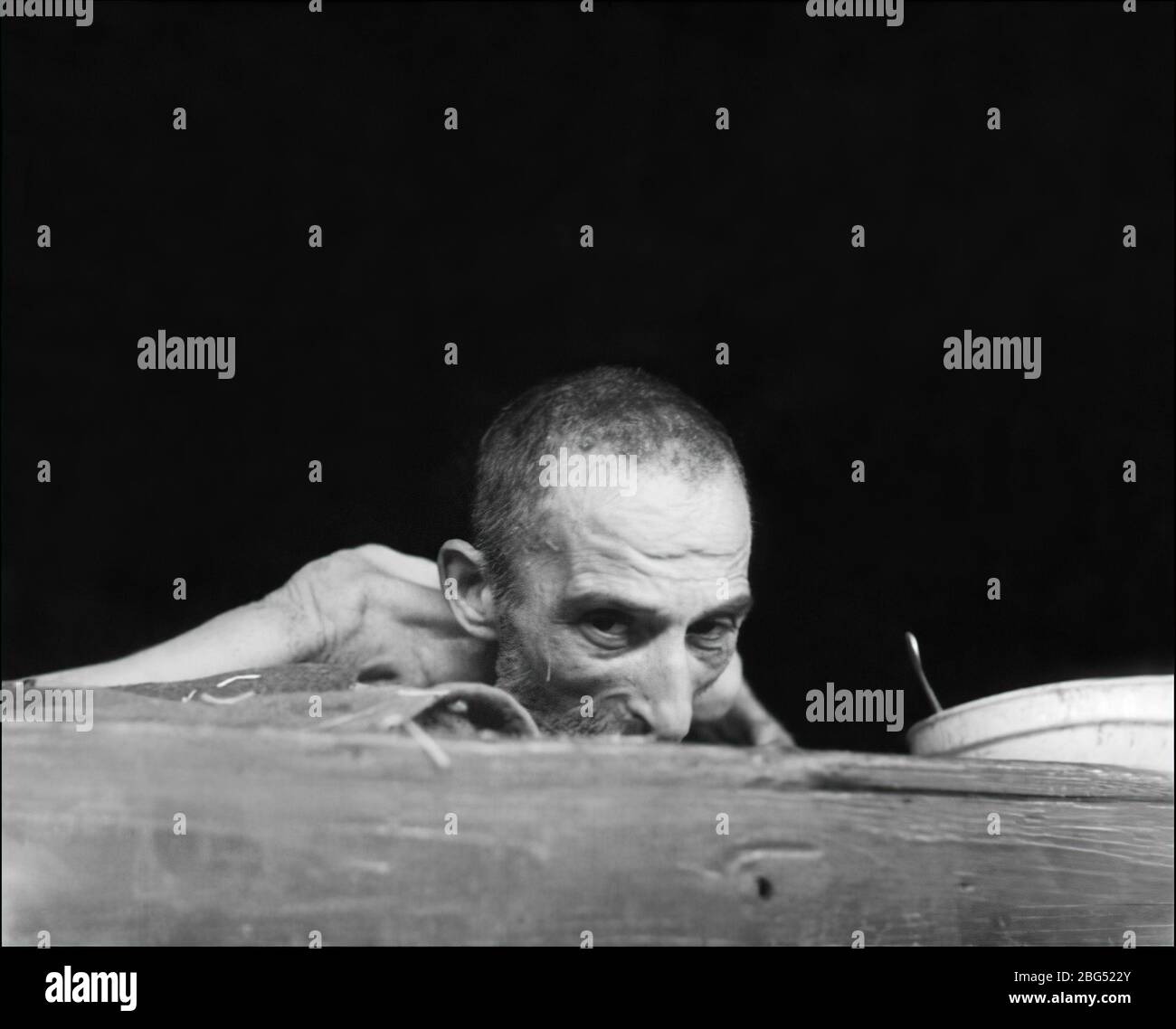 Second World War documentary. A prisoner dying of dysentery at the Buchenwald concentration ...