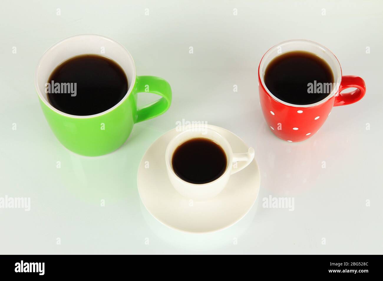 Cups of coffee isolated on white Stock Photo - Alamy