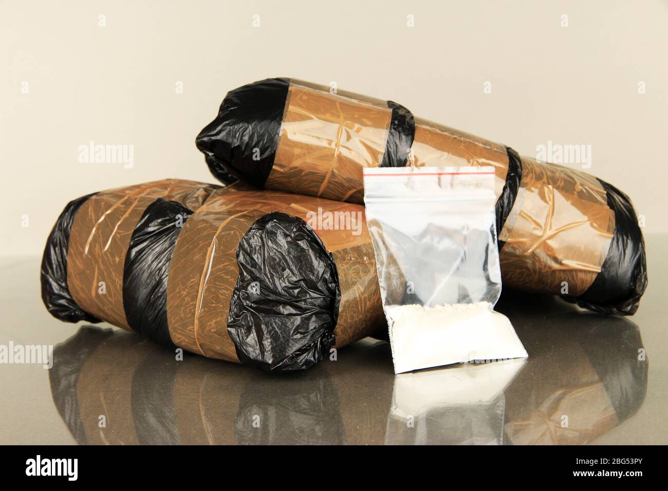 Packages of narcotics on gray background Stock Photo - Alamy