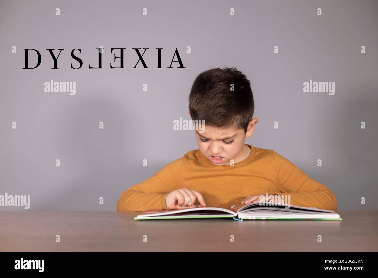 Little kid with dyslexia problems Stock Photo - Alamy