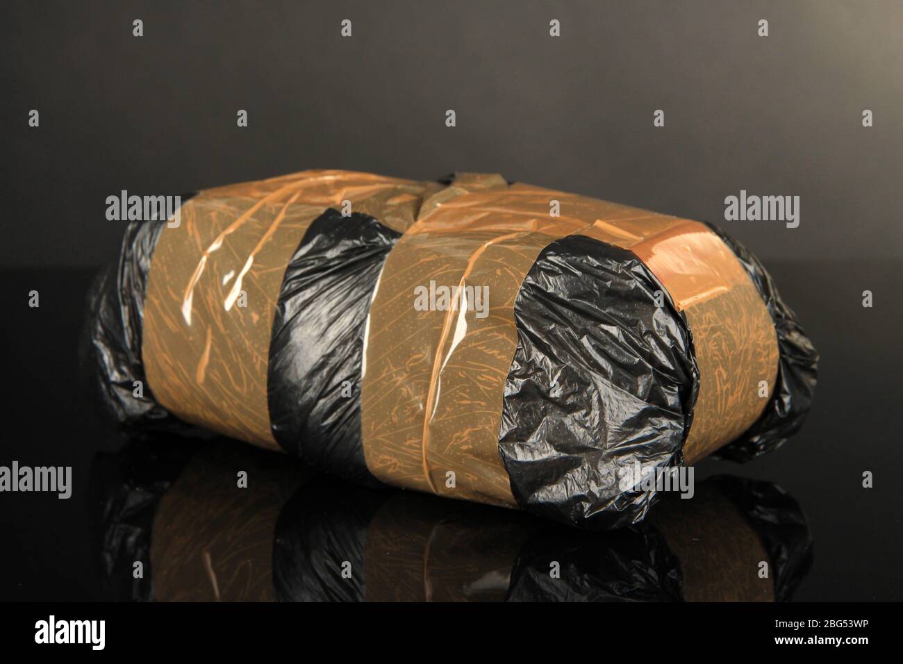 Packages of narcotics on dark gray background Stock Photo - Alamy