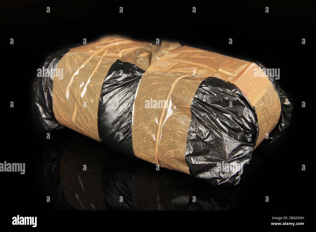 Packages of narcotics on dark gray background Stock Photo - Alamy