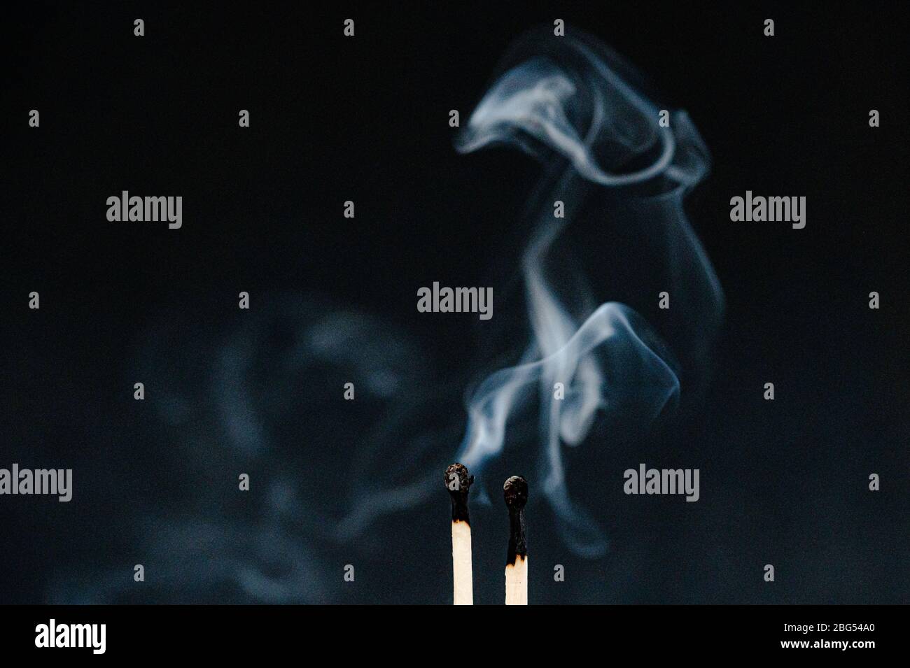 Smoke rising from extinguised matchsticks Stock Photo - Alamy