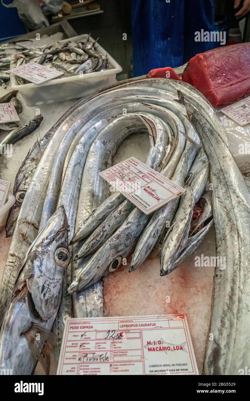 A group of silver swordfish for sale on a market stall Stock Photo - Alamy