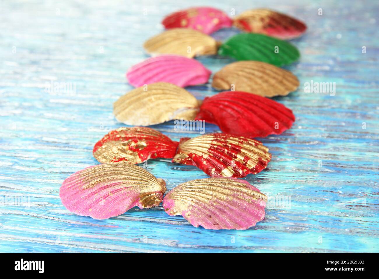 Colorful seashells on bright background Stock Photo - Alamy