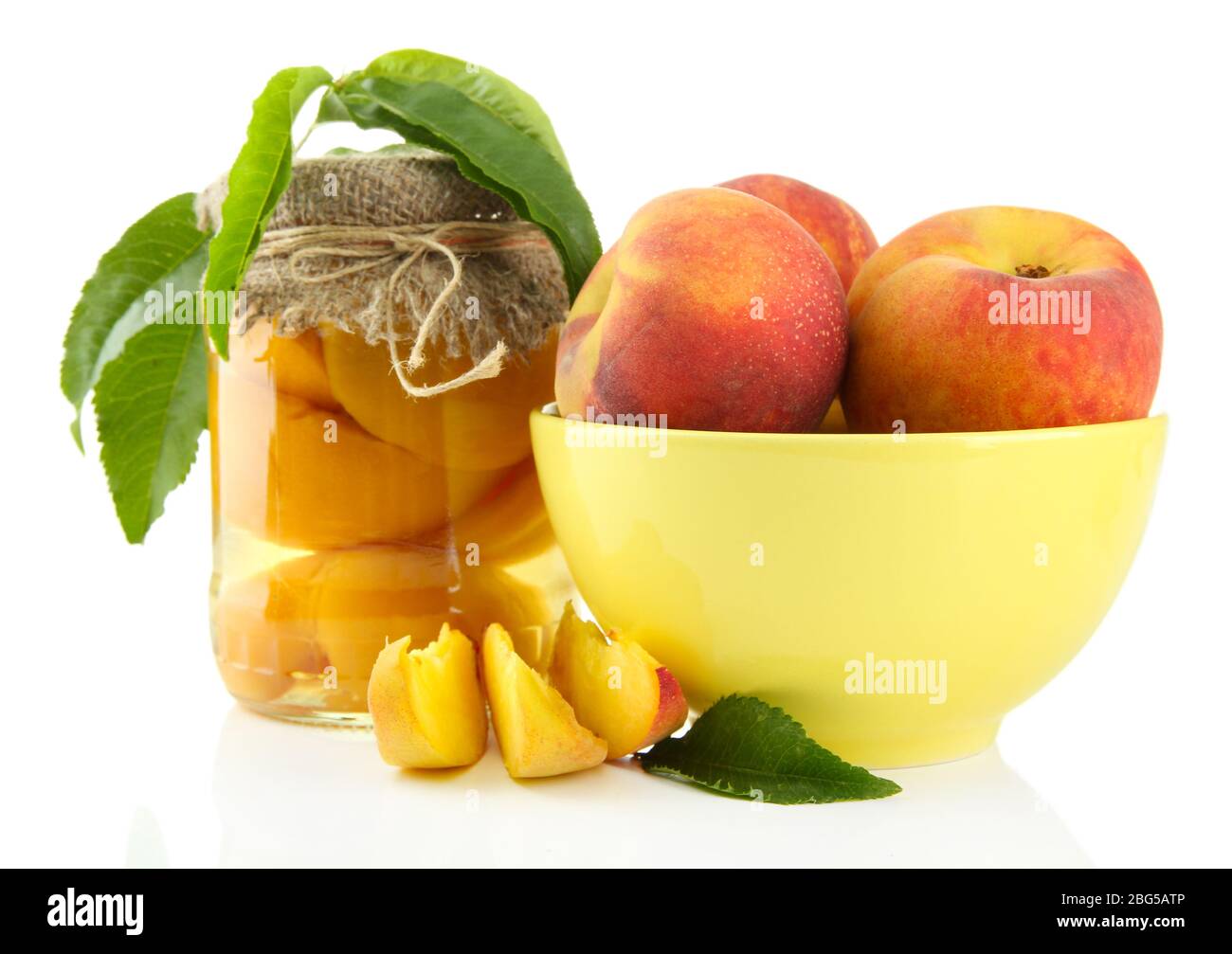 Jar of canned peaches and fresh peaches, isolated on white Stock Photo ...