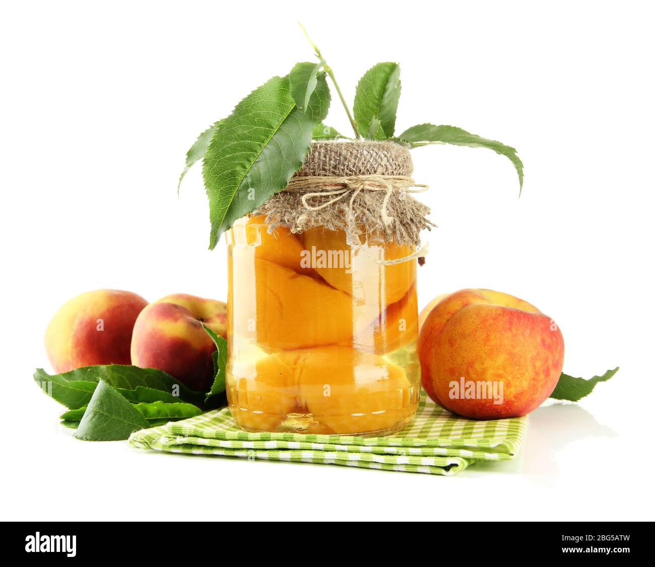 Jar of canned peaches and fresh peaches, isolated on white Stock Photo ...