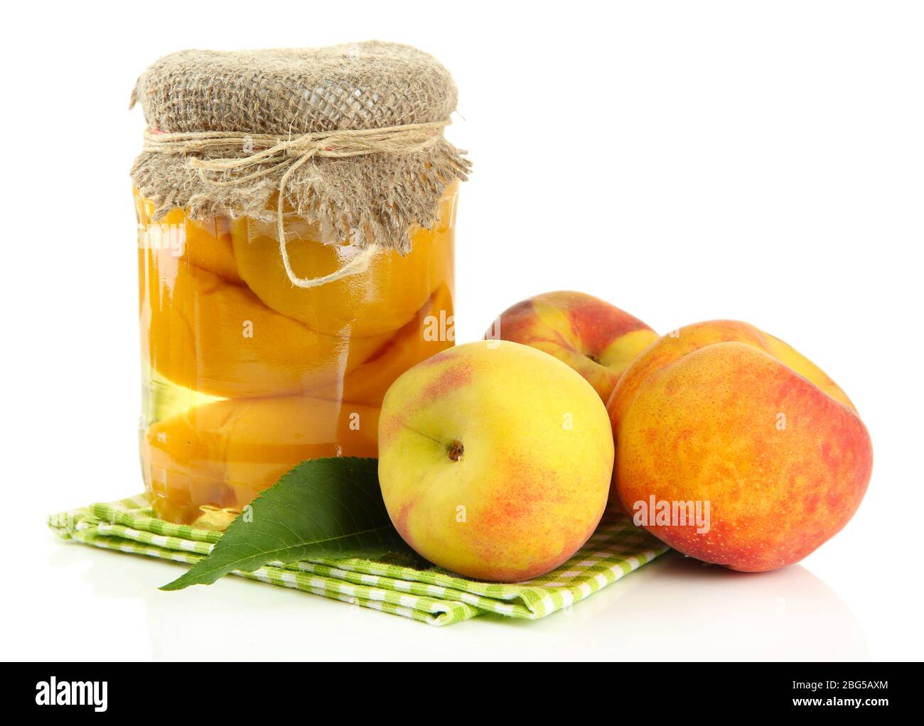 Jar of canned peaches and fresh peaches, isolated on white Stock Photo ...