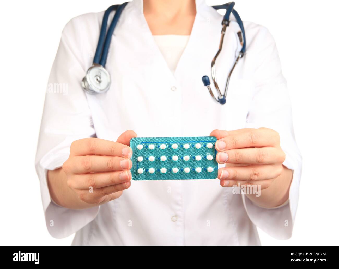 Hormonal pills in hands of doctor isolated on white Stock Photo - Alamy