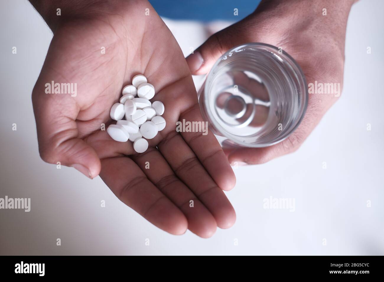 Person taking medicine hi-res stock photography and images - Alamy