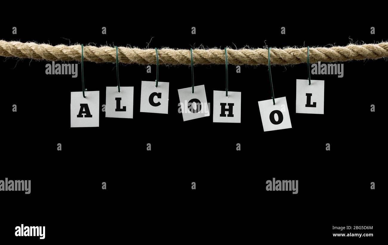 White tags with black capital letters forming the word alcohol, hanging ...