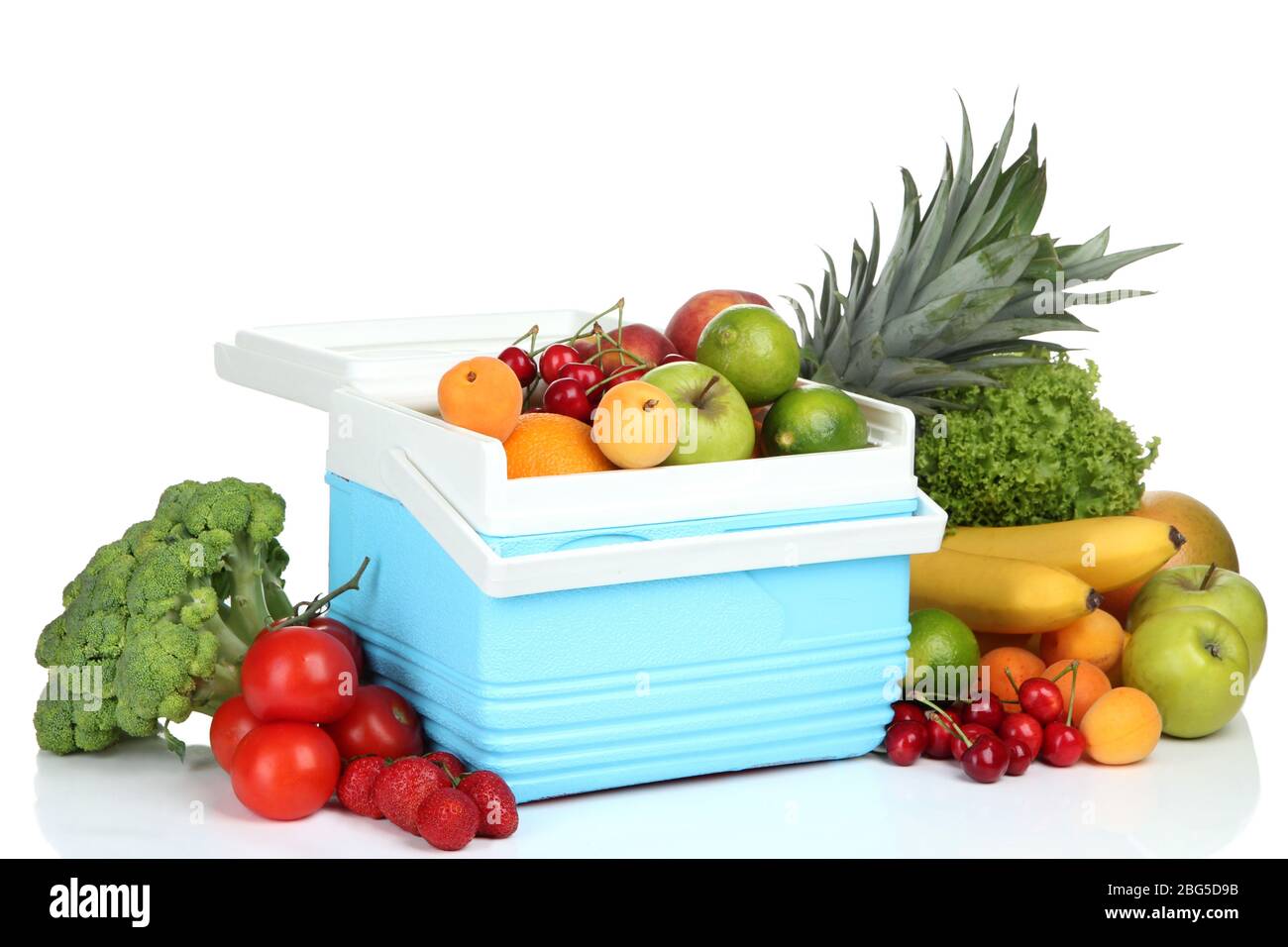 Fresh fruits and vegetables in mini refrigerator, isolated on white ...