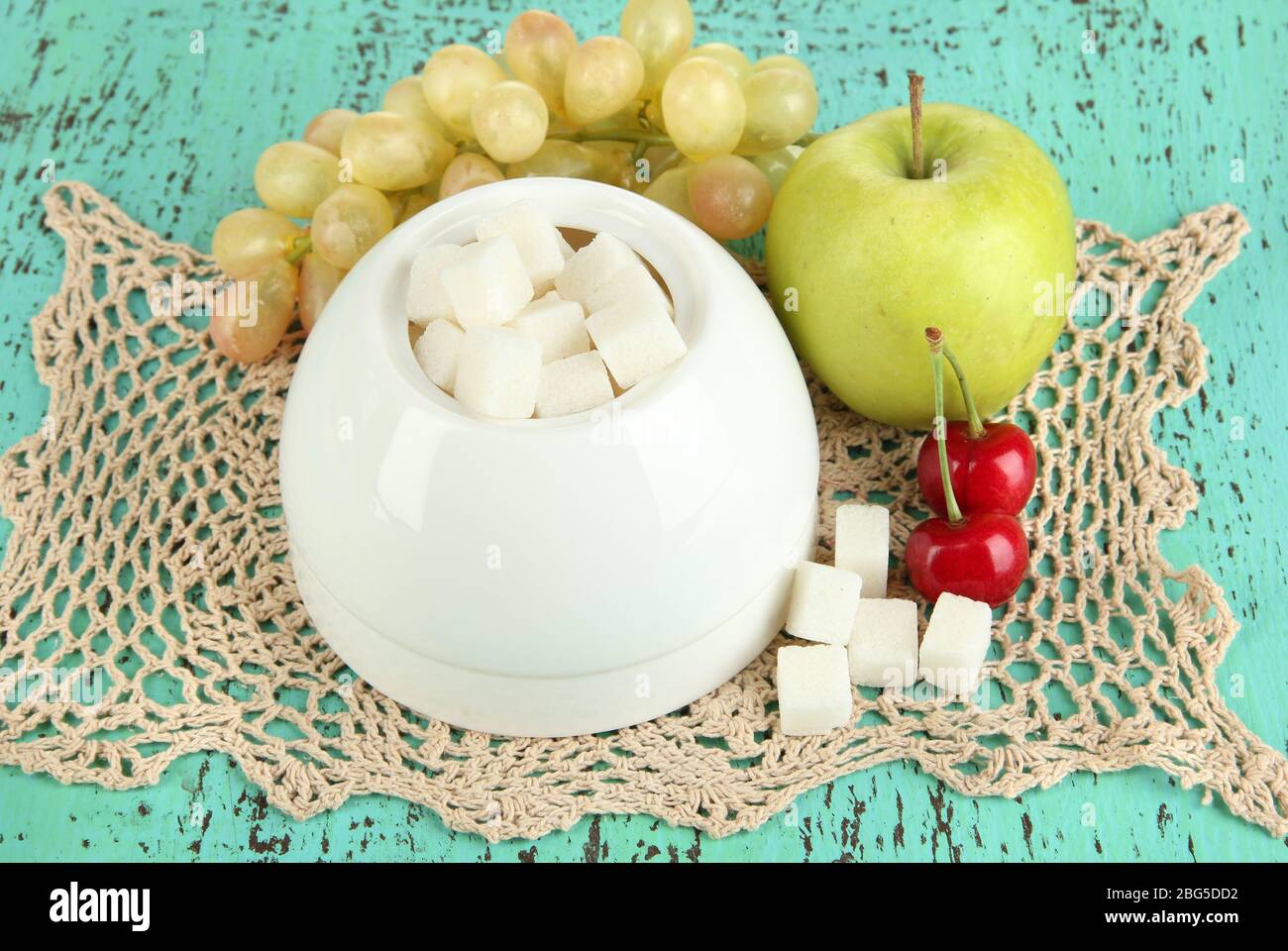 Refined sugar in white sugar bowl on wooden background Stock Photo - Alamy