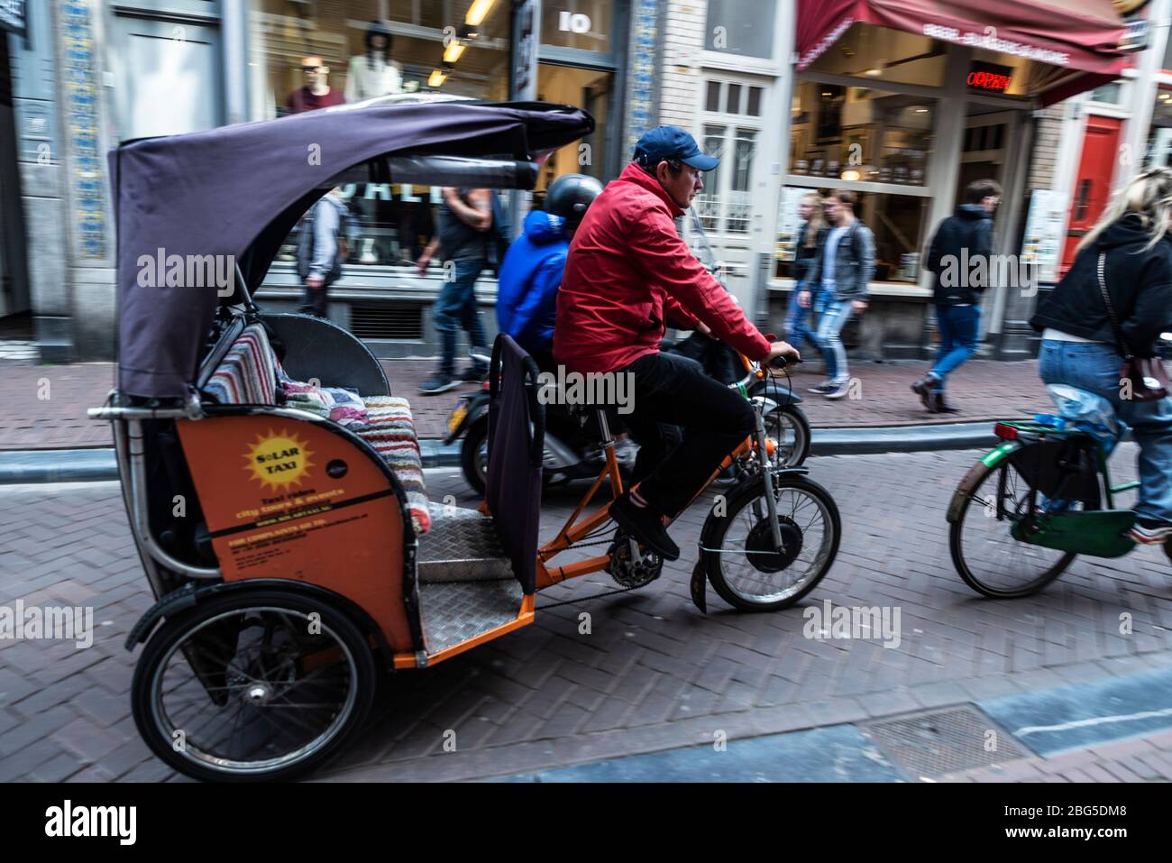 Amsterdam, Netherlands - September 7, 2018: Man on rickshaw taxi bike ...