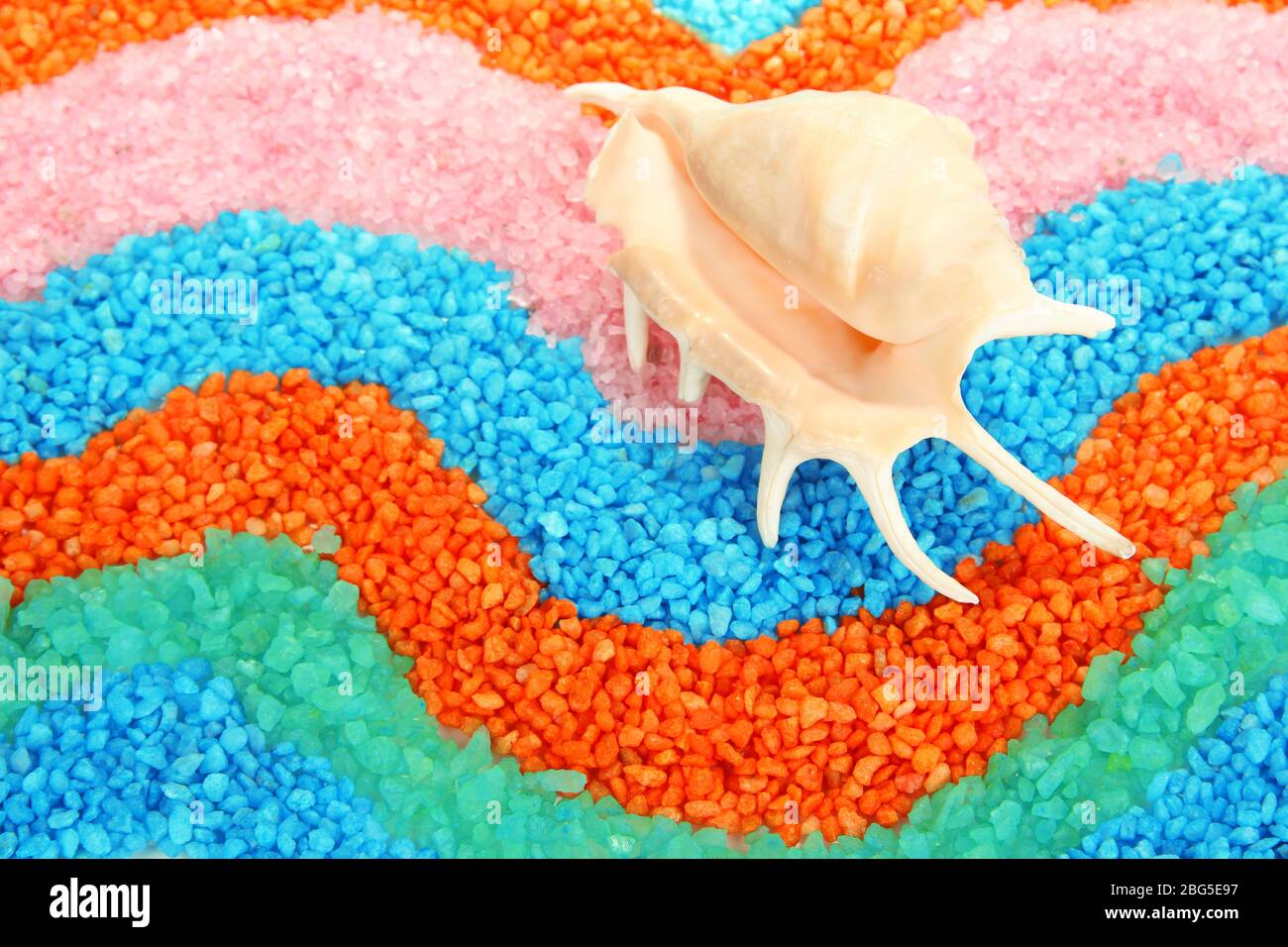 Shell on colorful crystals of sea salt background Stock Photo - Alamy