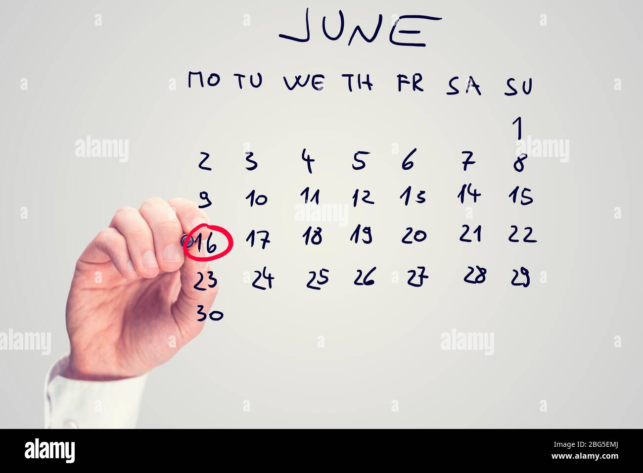 Male hand marking June 16th - International day of the african child ...