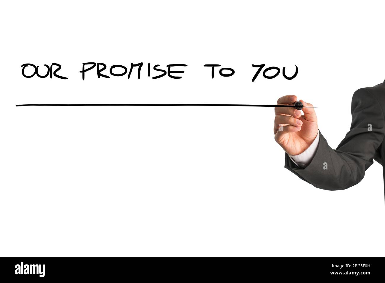 Hand of a man writing Our promise to you on a virtual screen or ...