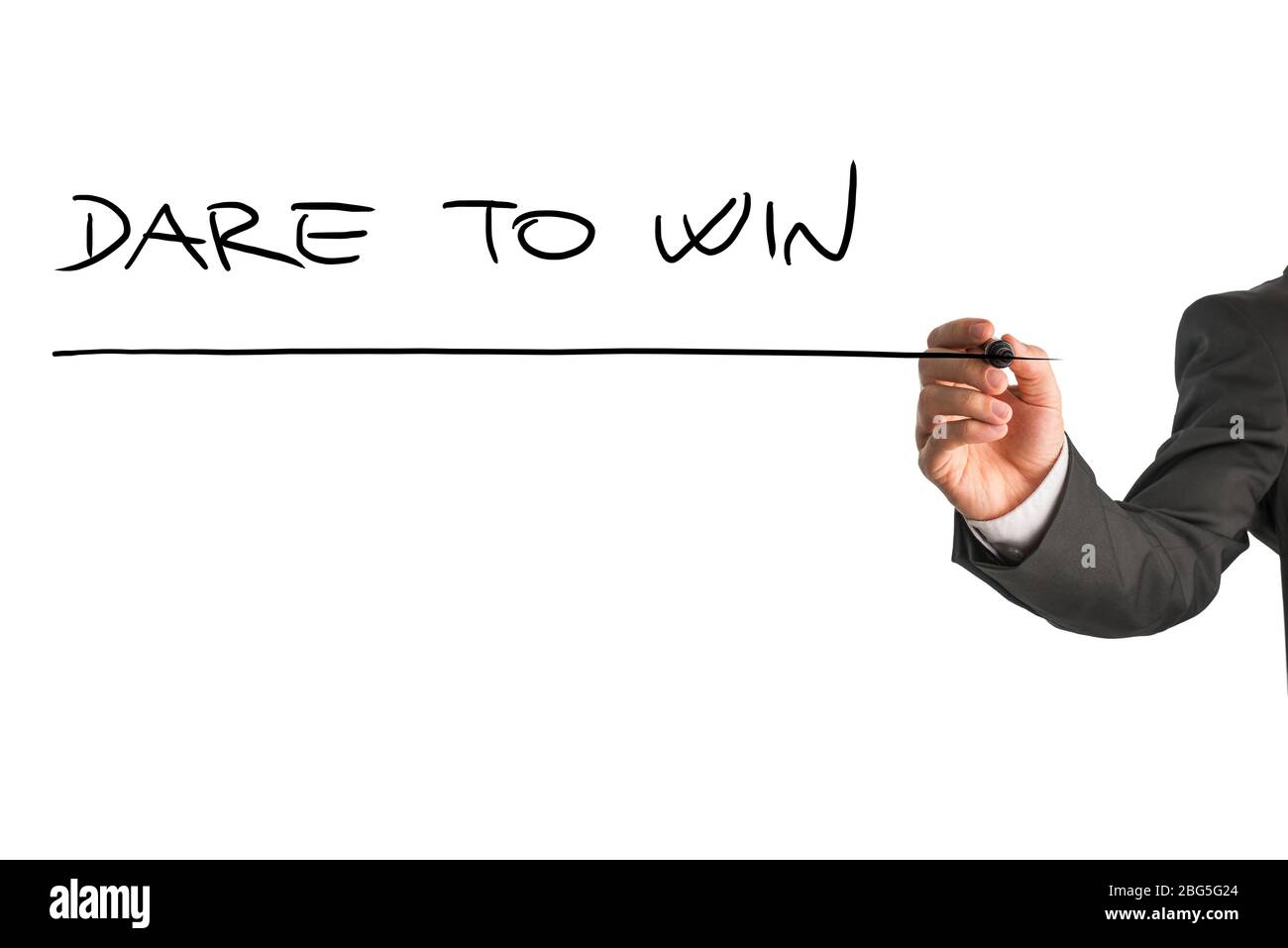 Man writing a business motivational message - Dare to win - on a ...
