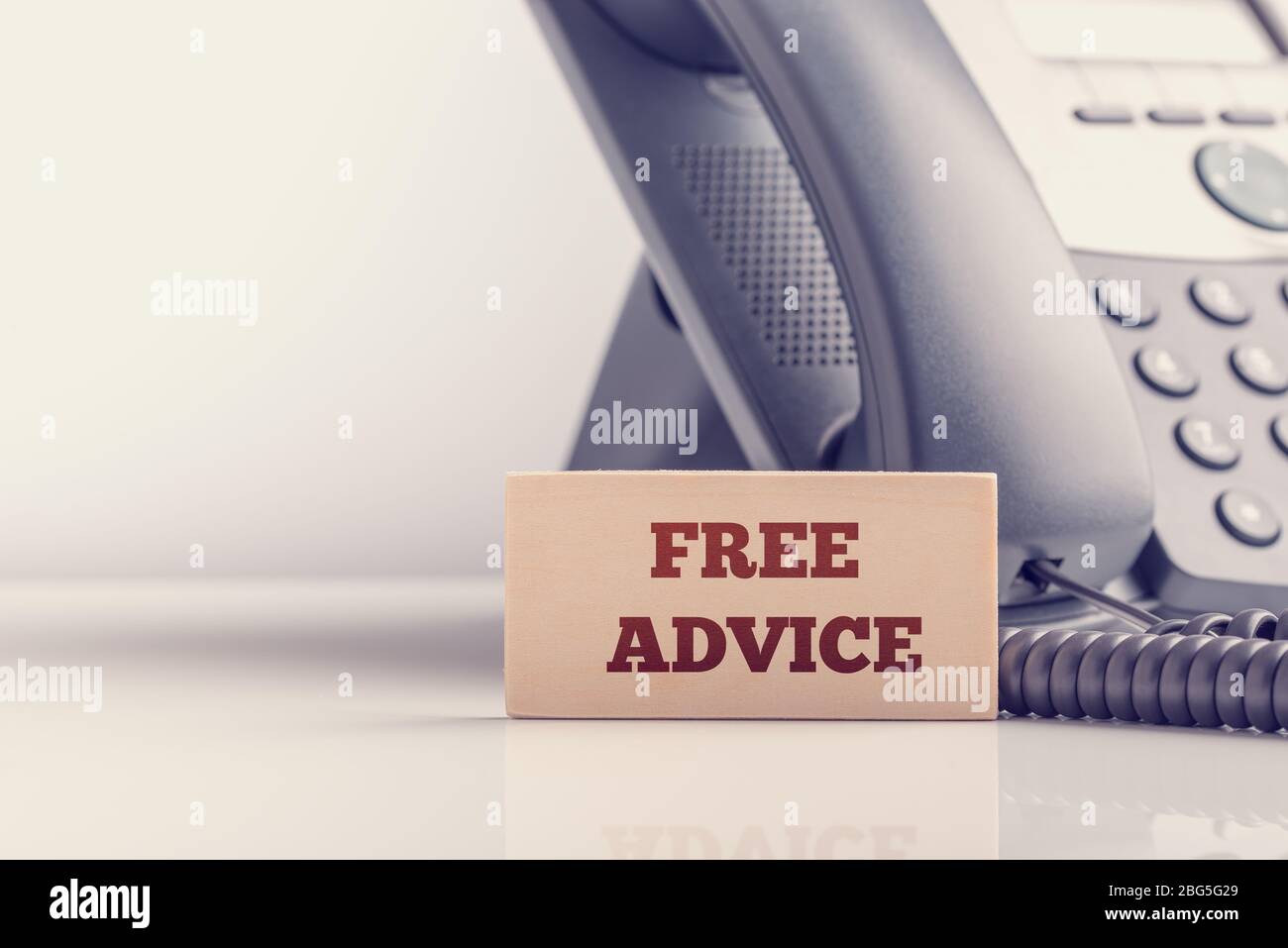 Retro effect faded and toned image of a classic landline telephone with ...