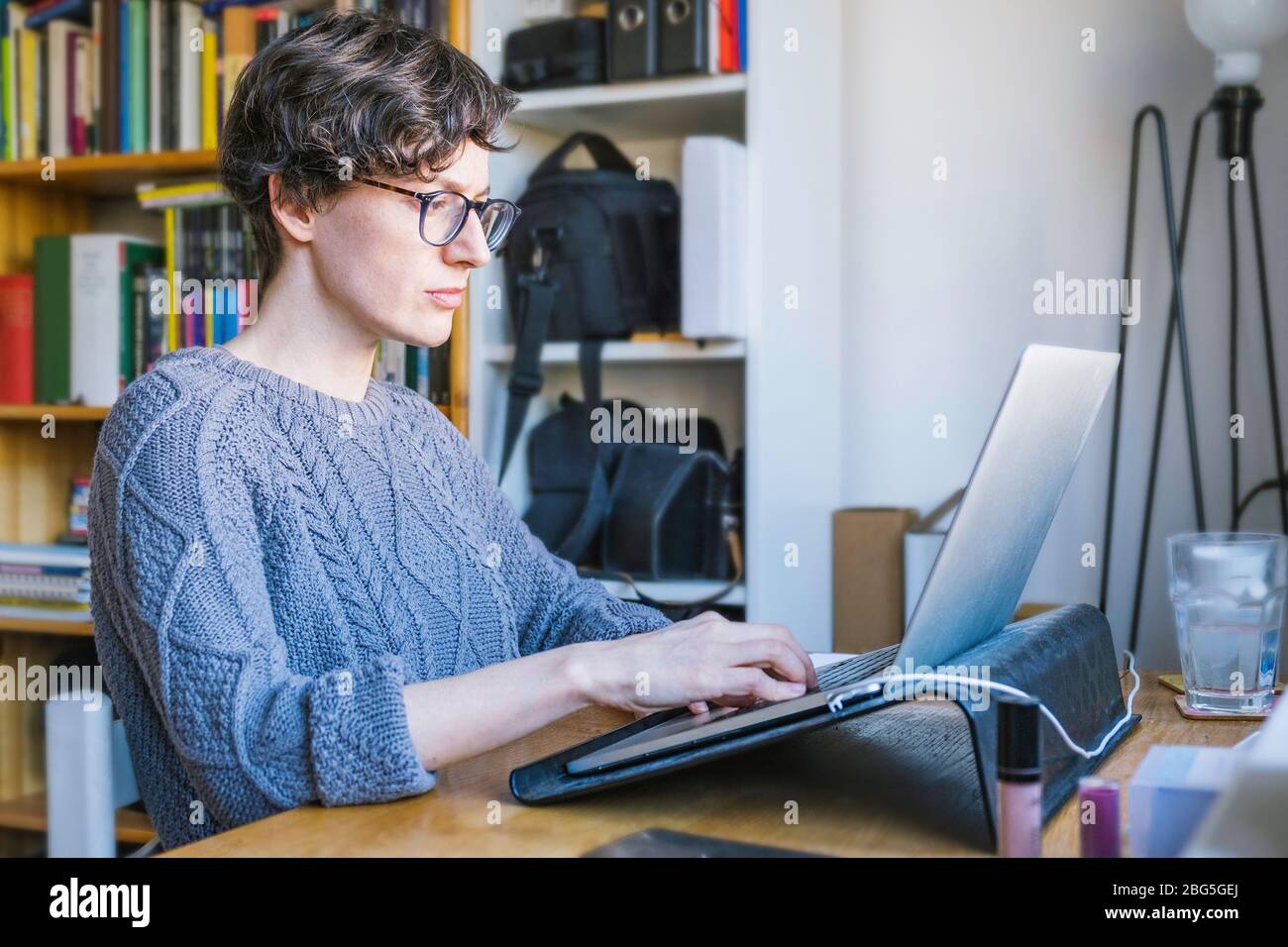 Woman working from home office. Young Caucasian short hair entrepreneur ...