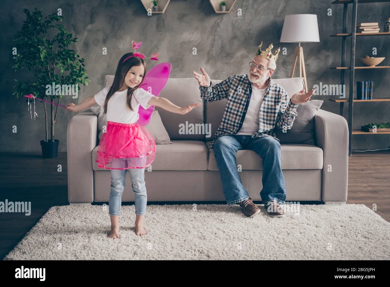 Photo of aged old grandpa little pretty granddaughter sit comfy sofa ...