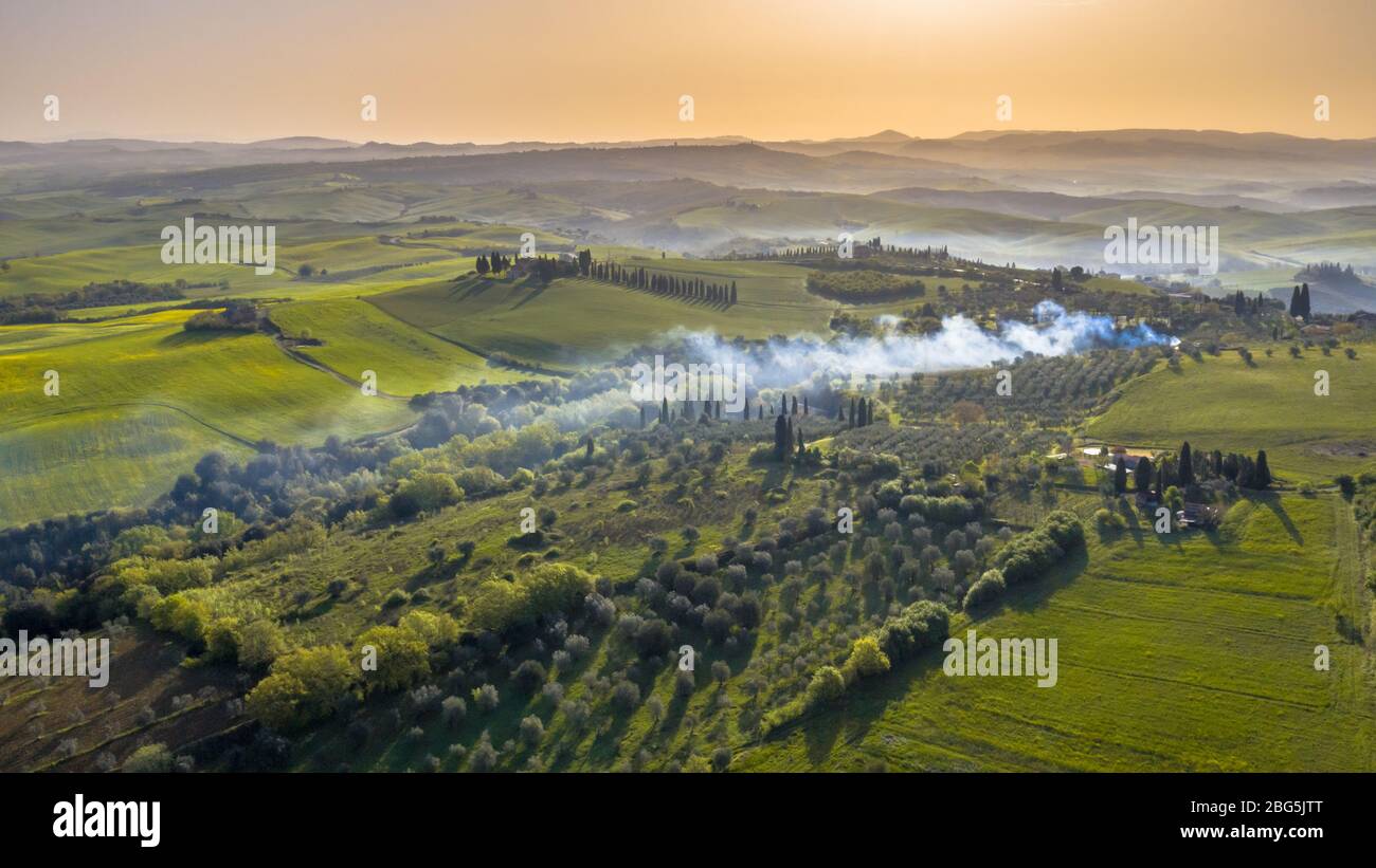 Aerial view of Tuscan countryside on foggy early morning sunrise in ...