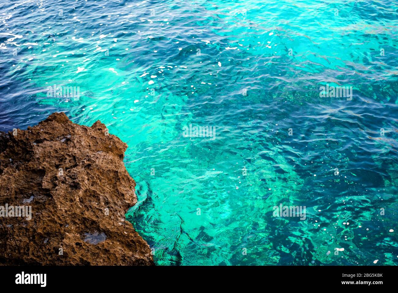 rocks and transparent azure water Stock Photo - Alamy