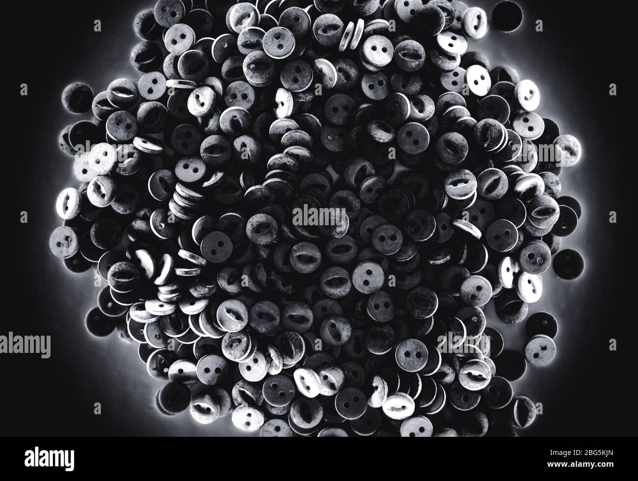 a lot of plastic buttons on dark background Stock Photo - Alamy