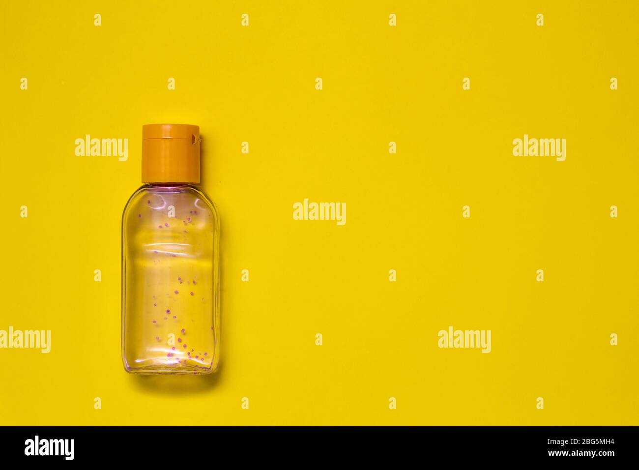 Antiseptic On yellow background, with pink granules Stock Photo - Alamy