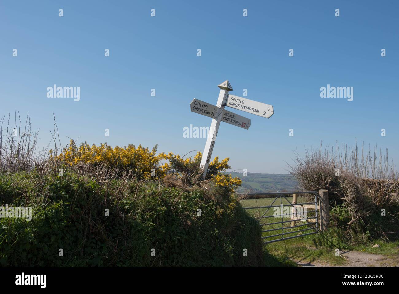 Traditional Devonian Signpost on a Grassy Bank at a Crossroads with a ...