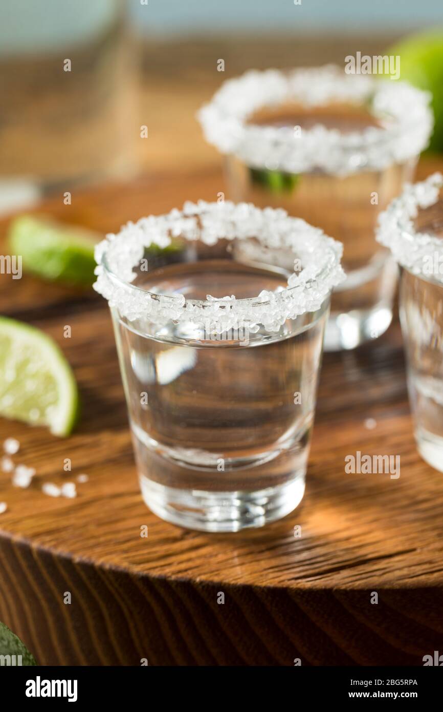 Alcoholic Tequila Shots with Lime and Salt Stock Photo - Alamy