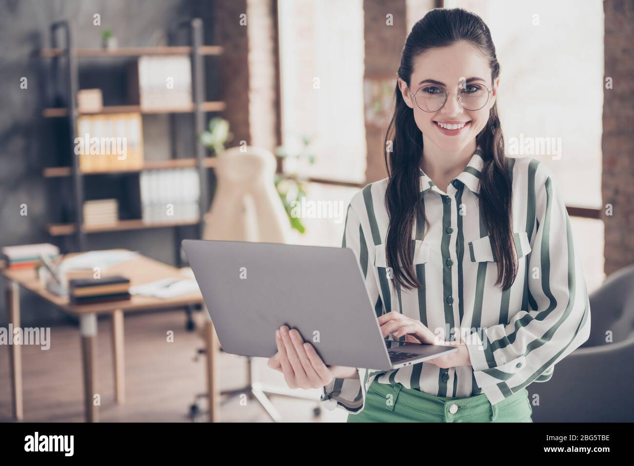 Portrait of positive cheerful company owner executive manager worker ...