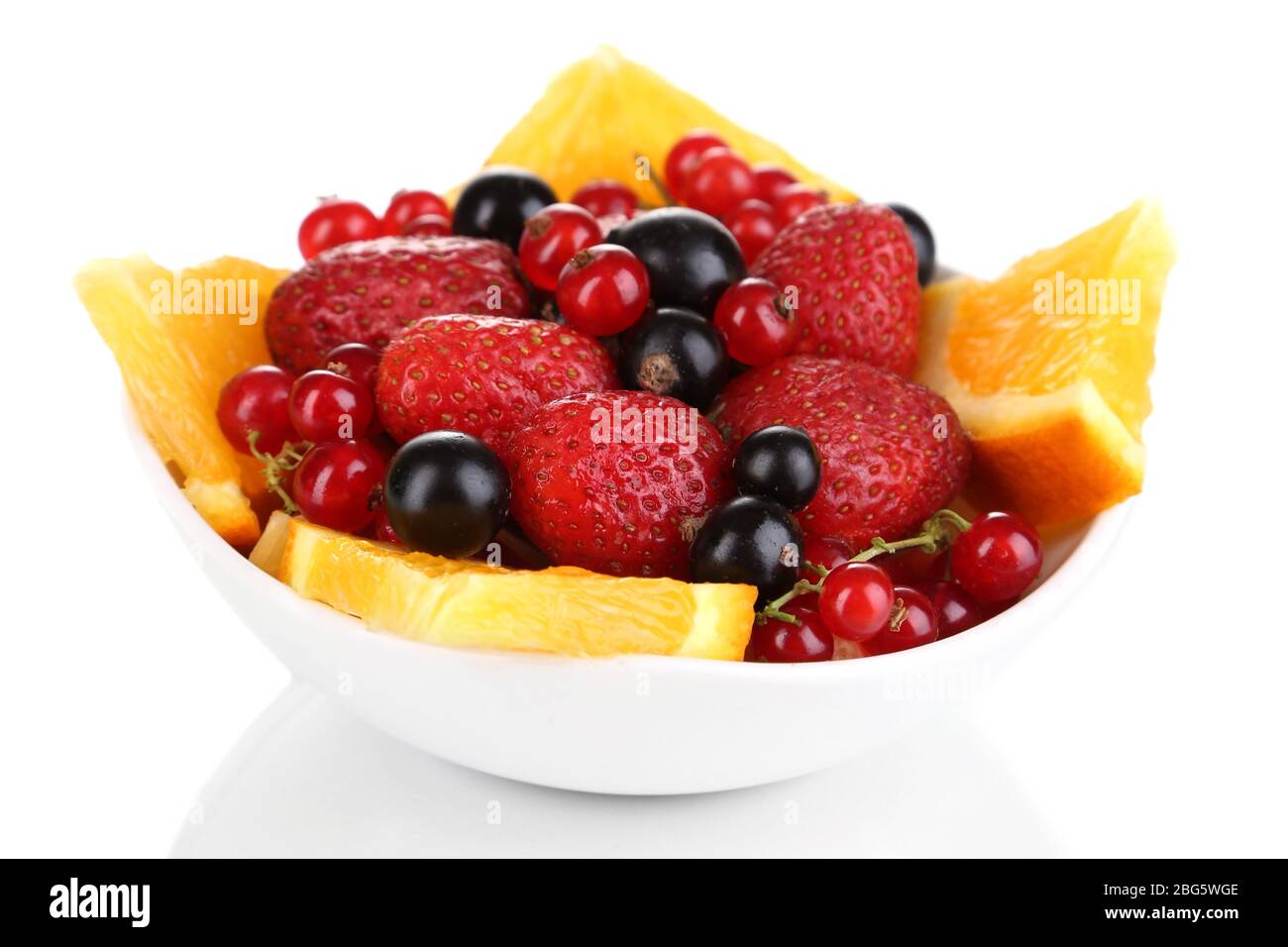 Useful fruit salad of fresh fruits and berries in bowl isolated on ...