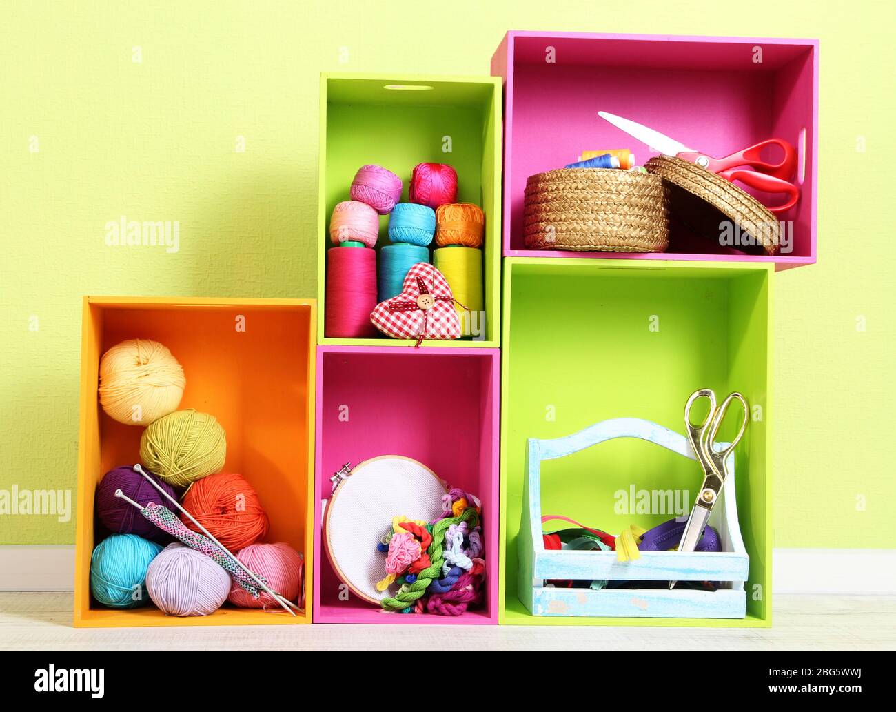 Colorful shelves of different colors with utensils on wall background ...