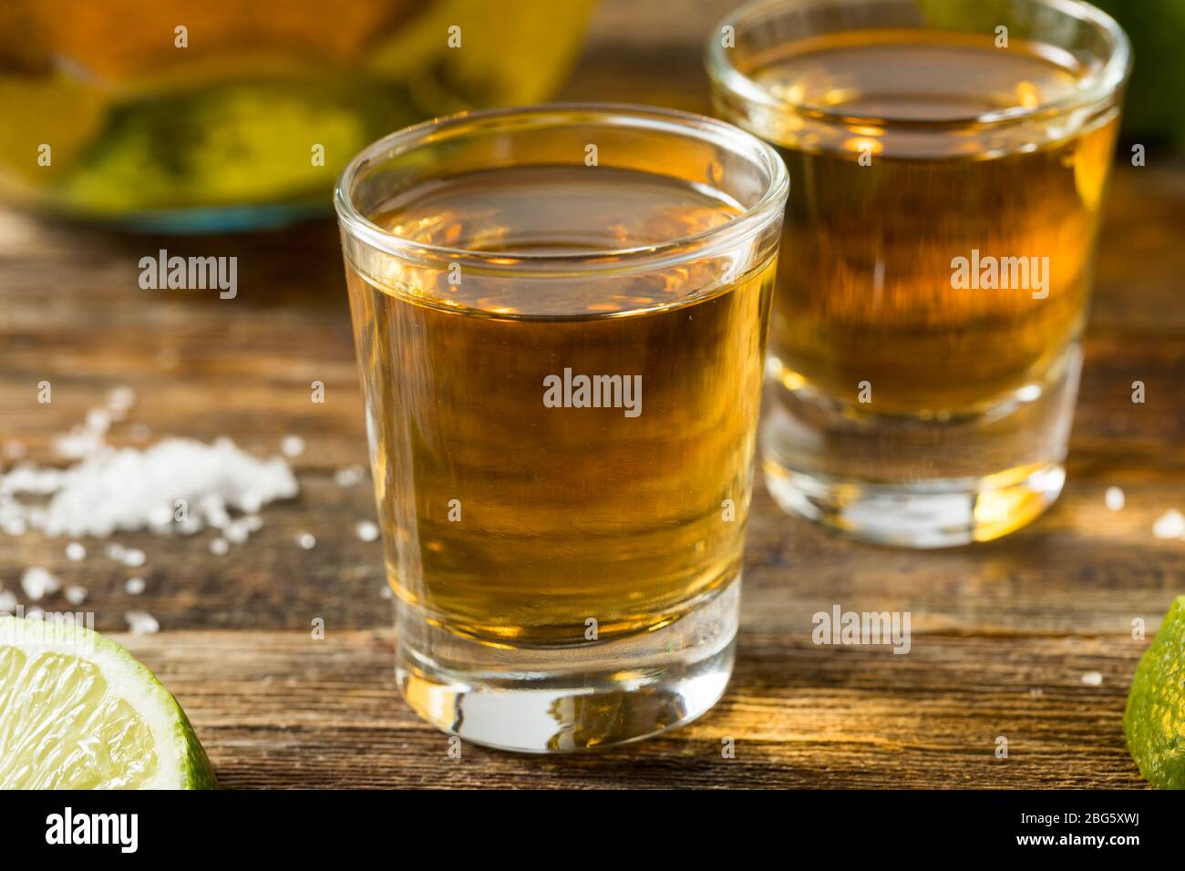 Alcoholic Reposado Tequila Shots with Lime and Salt Stock Photo - Alamy