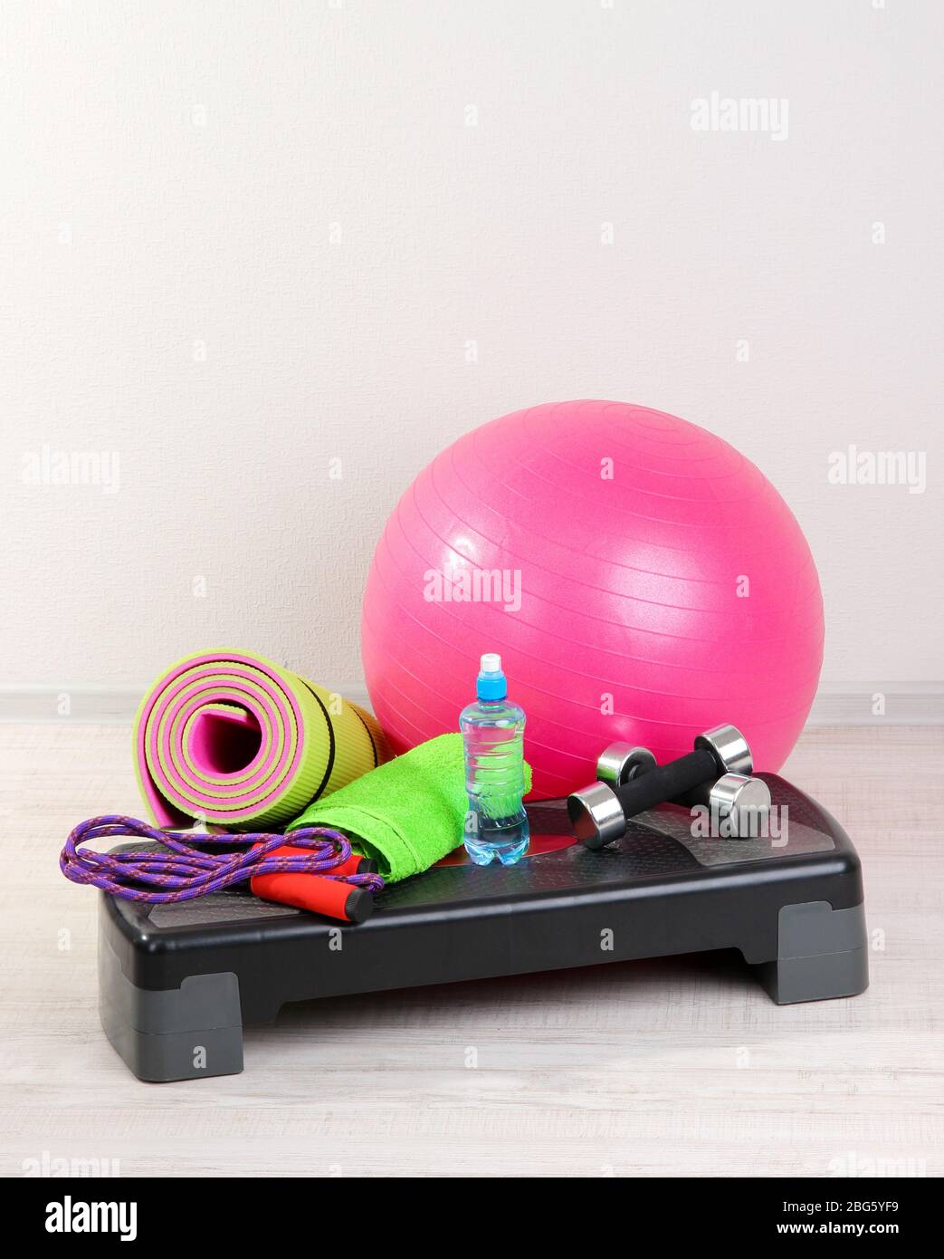 Different tools for fitness in room Stock Photo - Alamy