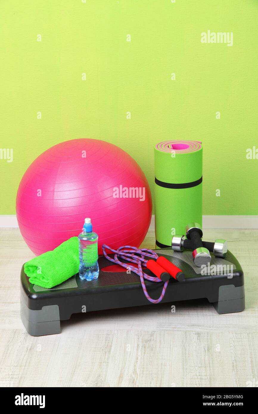 Different tools for fitness in room Stock Photo - Alamy