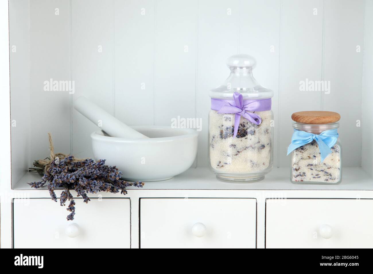 Still life with jar of lavender sugar, mortar and fresh lavender flowers on shelves Stock Photo ...