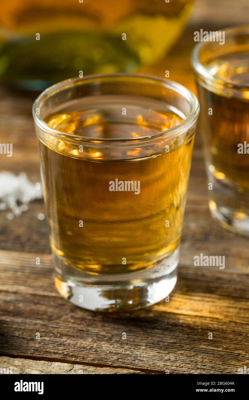 Alcoholic Reposado Tequila Shots with Lime and Salt Stock Photo - Alamy