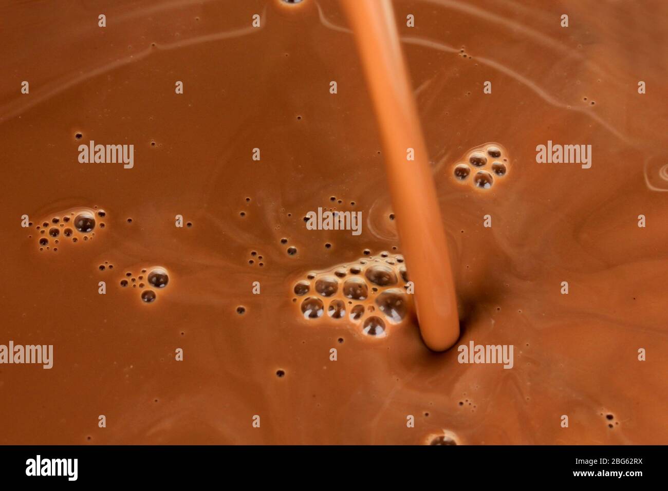 Pouring chocolate close-up Stock Photo - Alamy
