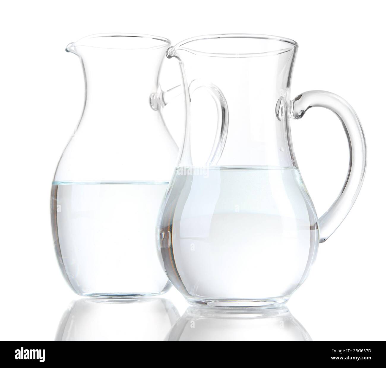Glass pitchers of water isolated on white Stock Photo - Alamy
