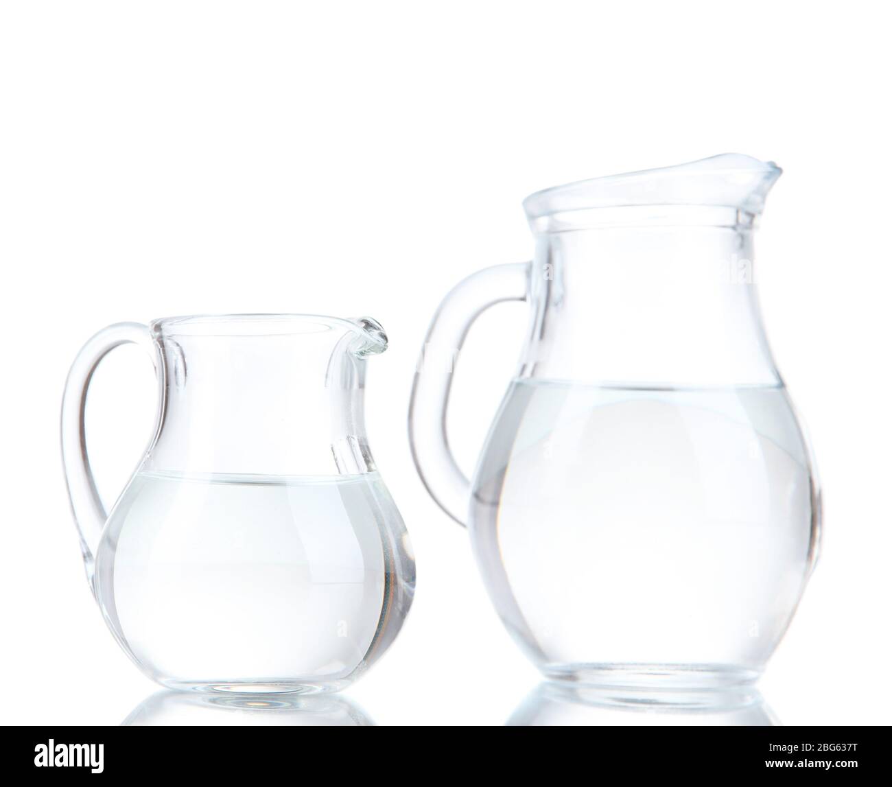 Glass pitchers of water isolated on white Stock Photo - Alamy