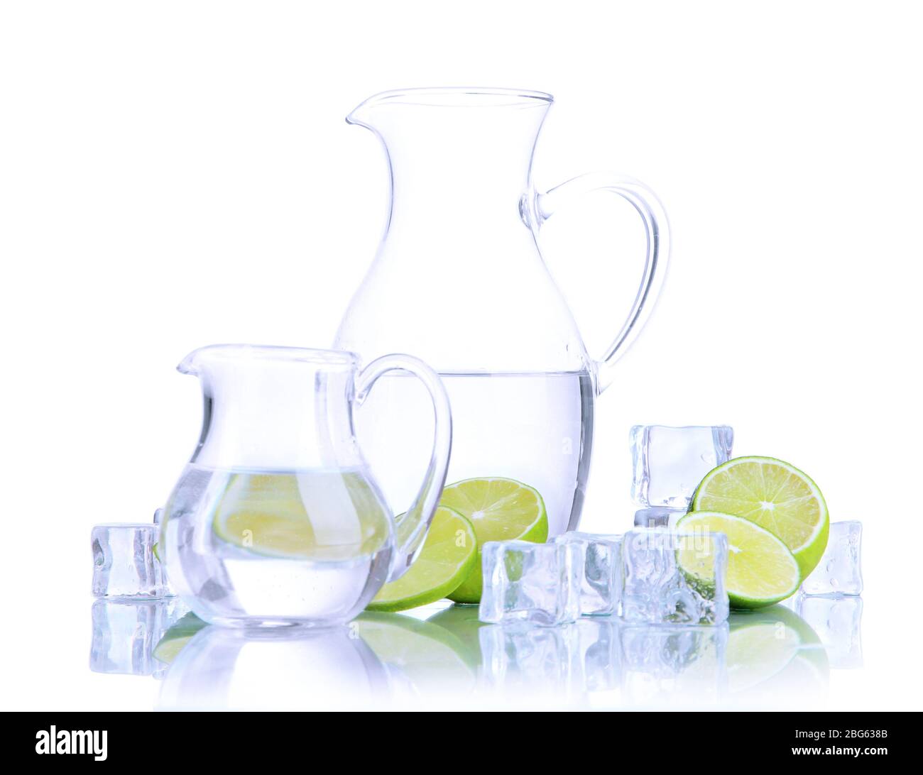 Glass pitchers of water with ice and lime isolated on white Stock Photo ...